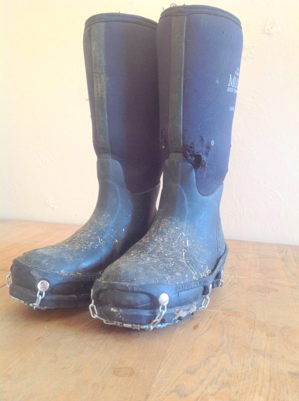 My very worn Muck Boots (with a pair of ice cleats attached)